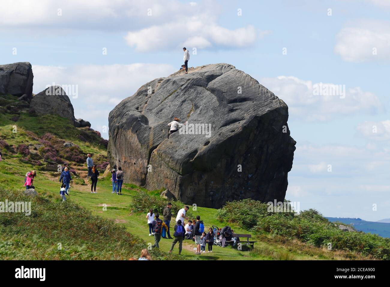 Tourists at the Cow & Calf Rocks in Ilkley,West Yorkshire Stock Photo ...