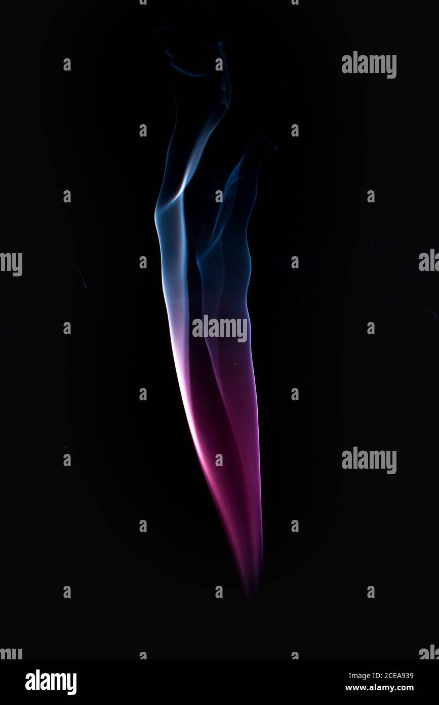 Swirls of bright blue fume Stock Photo - Alamy