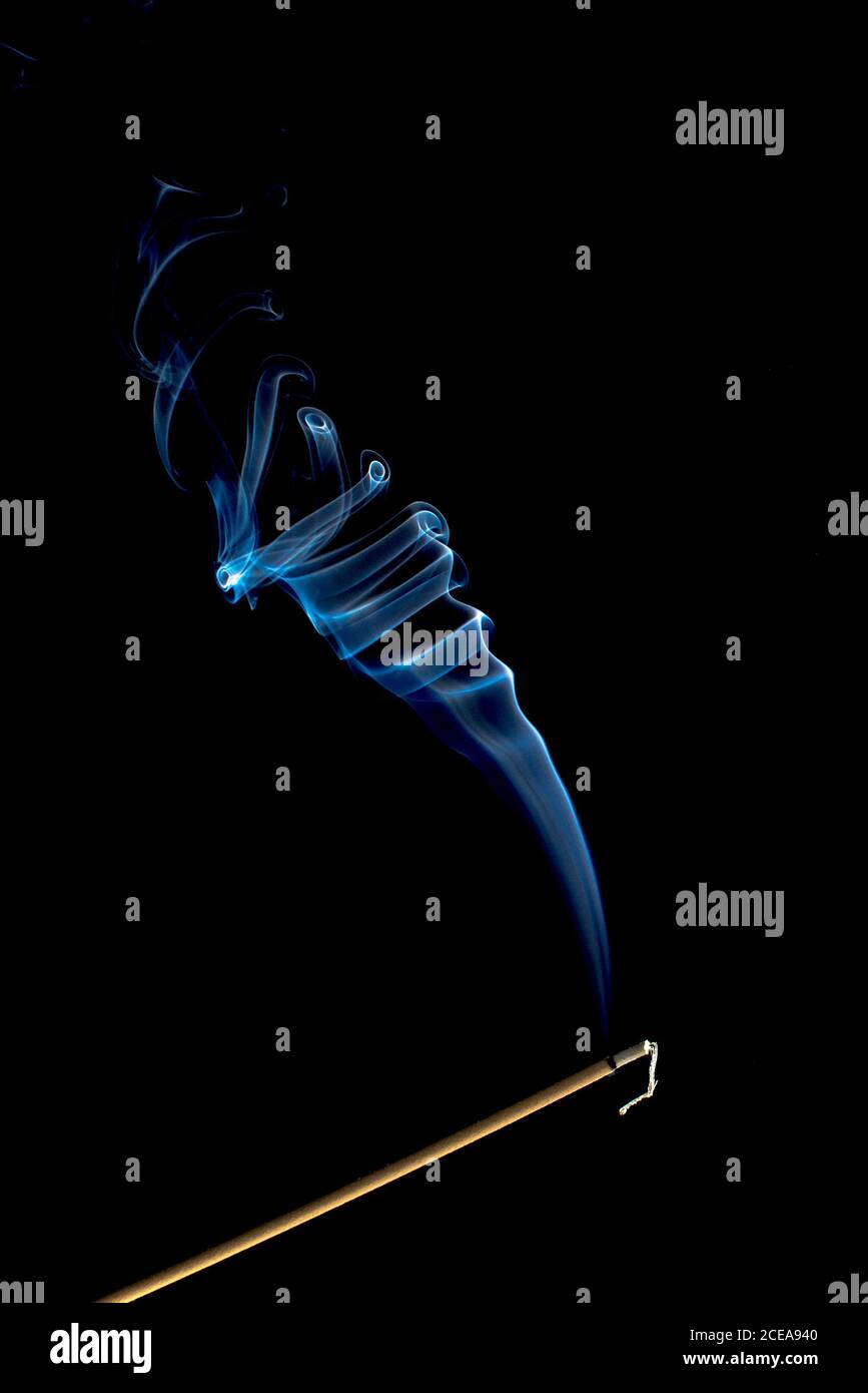 Swirls of bright blue fume Stock Photo - Alamy