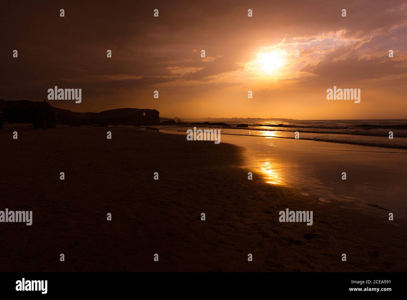 Majestic view of cloudy evening sky over wonderful waving sea and wet ...
