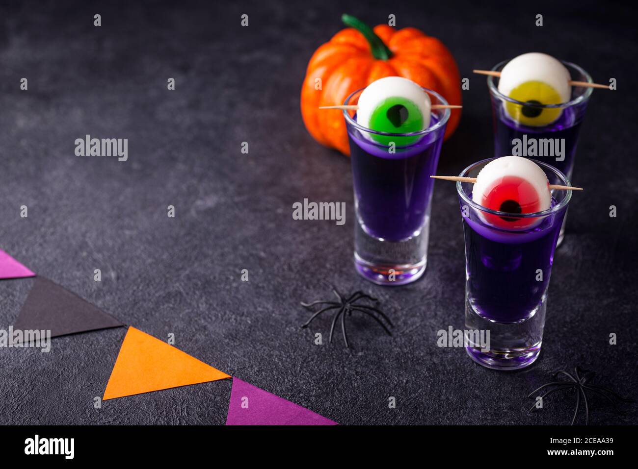 Halloween purple cocktail with eyes Stock Photo - Alamy