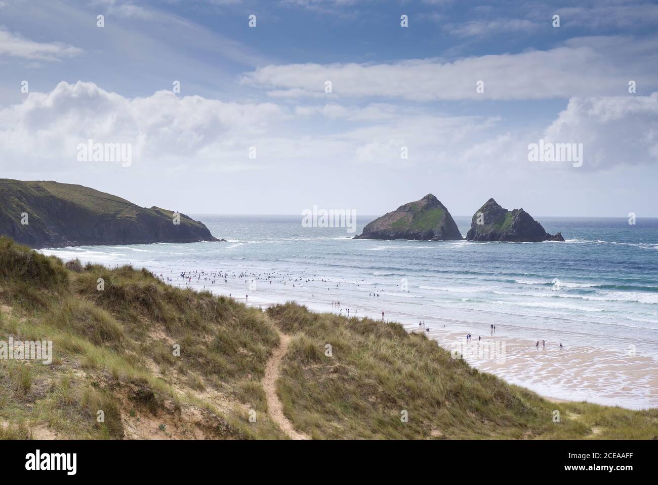 Scenic Holywell Bay with Gull Rocks twin islets in the background ...