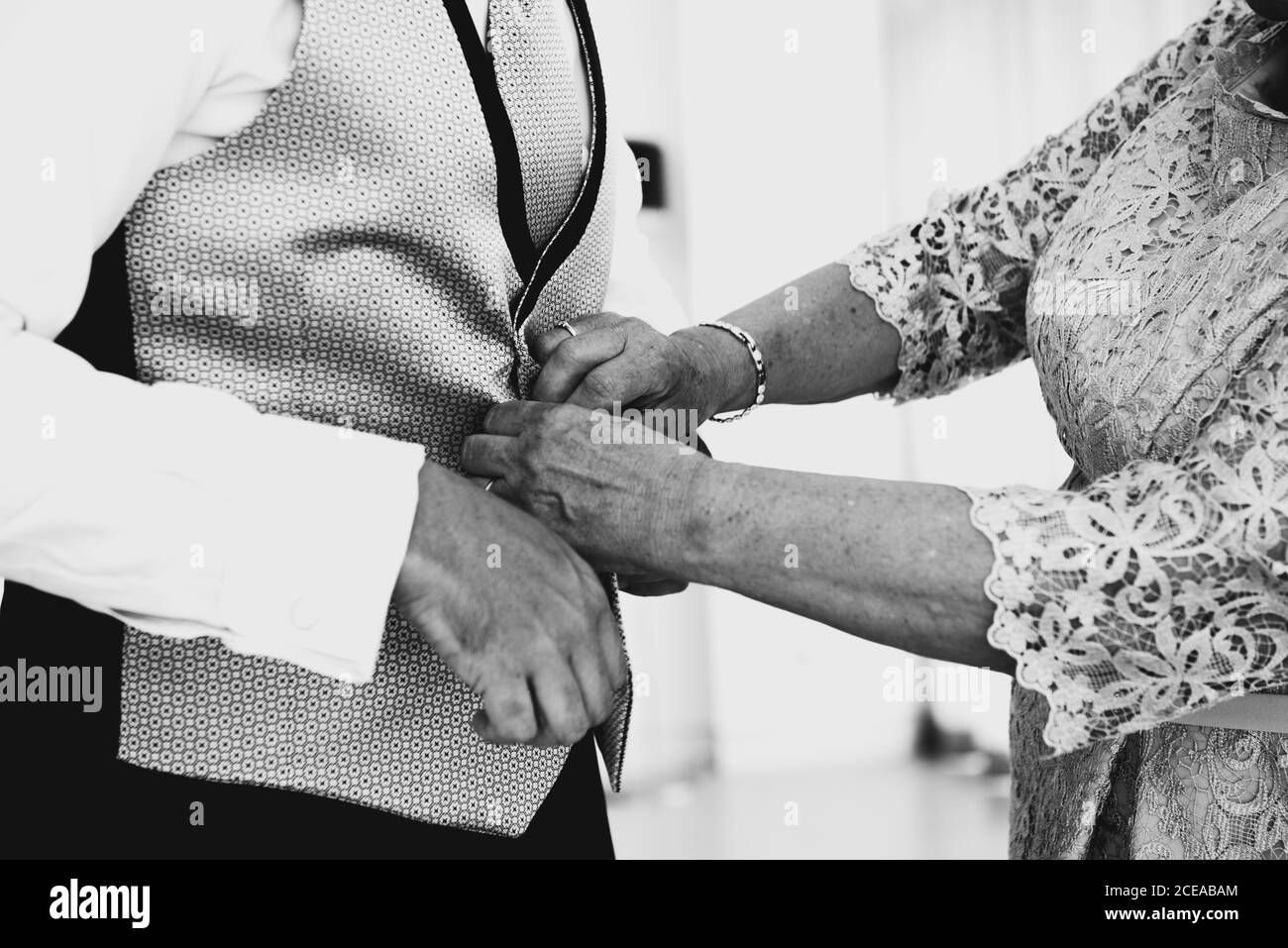 Woman buttoning her shirt Black and White Stock Photos & Images - Alamy