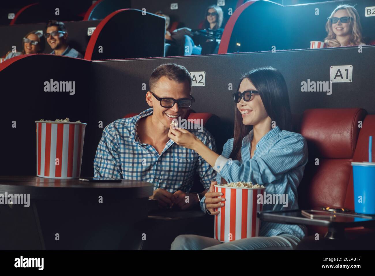 Young people friends together in the cinema Stock Photo - Alamy