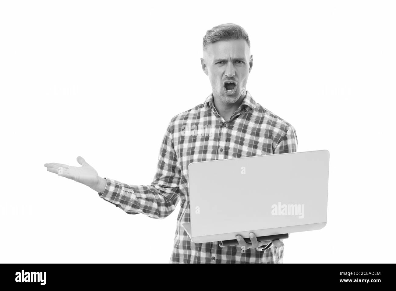Virus alert. Desperate man hold laptop isolated on white. Computer ...