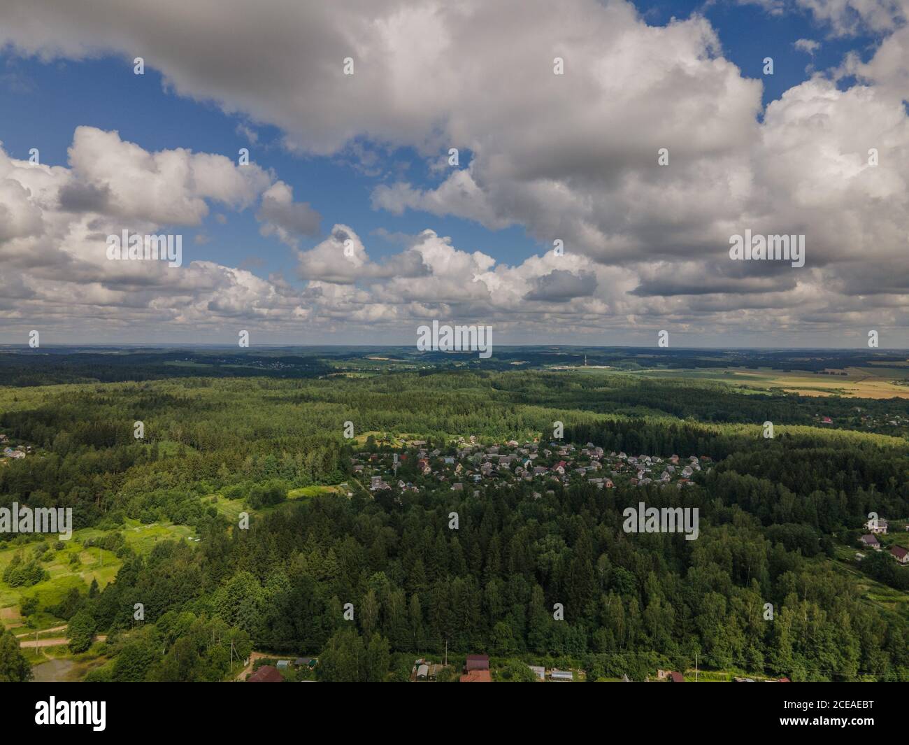 High View from the height of a flying drone, a small village with ...