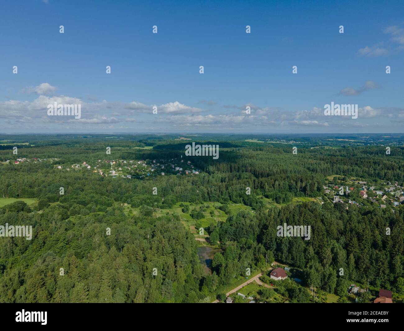 High View from the height of a flying drone, a small village with ...