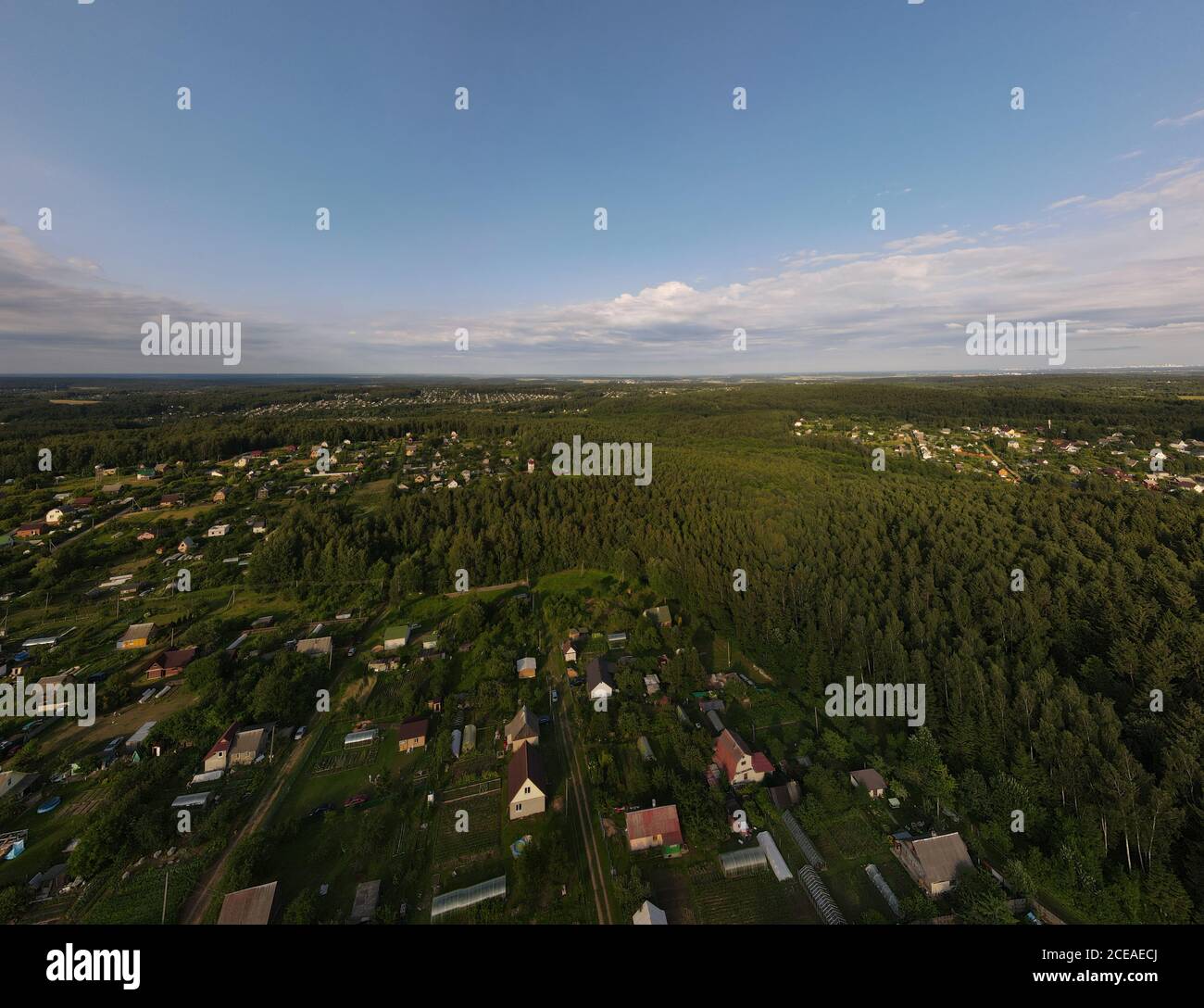 High View from the height of a flying drone, a small village with ...