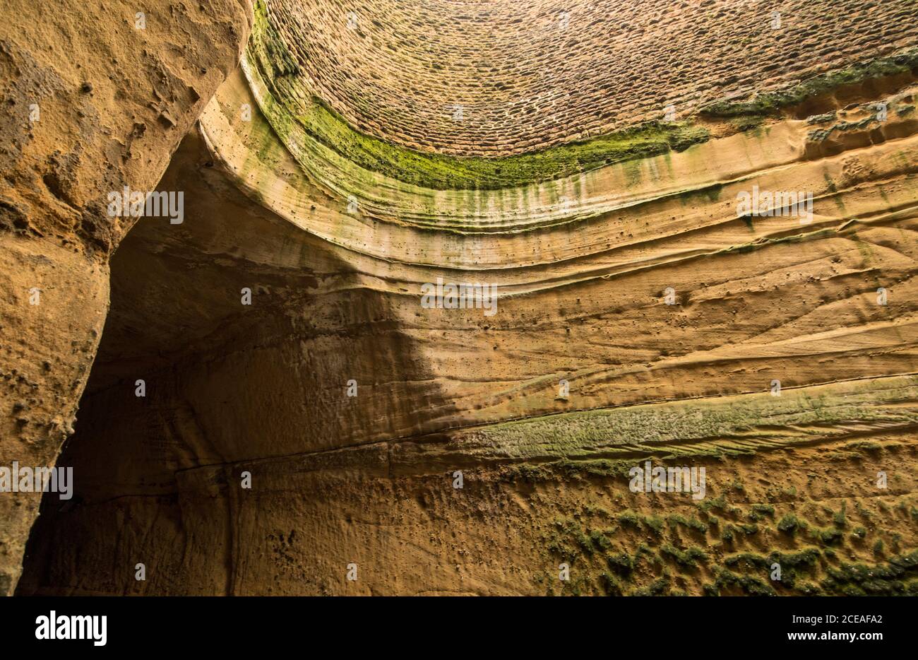 Rock face tunnel example Stock Photo - Alamy