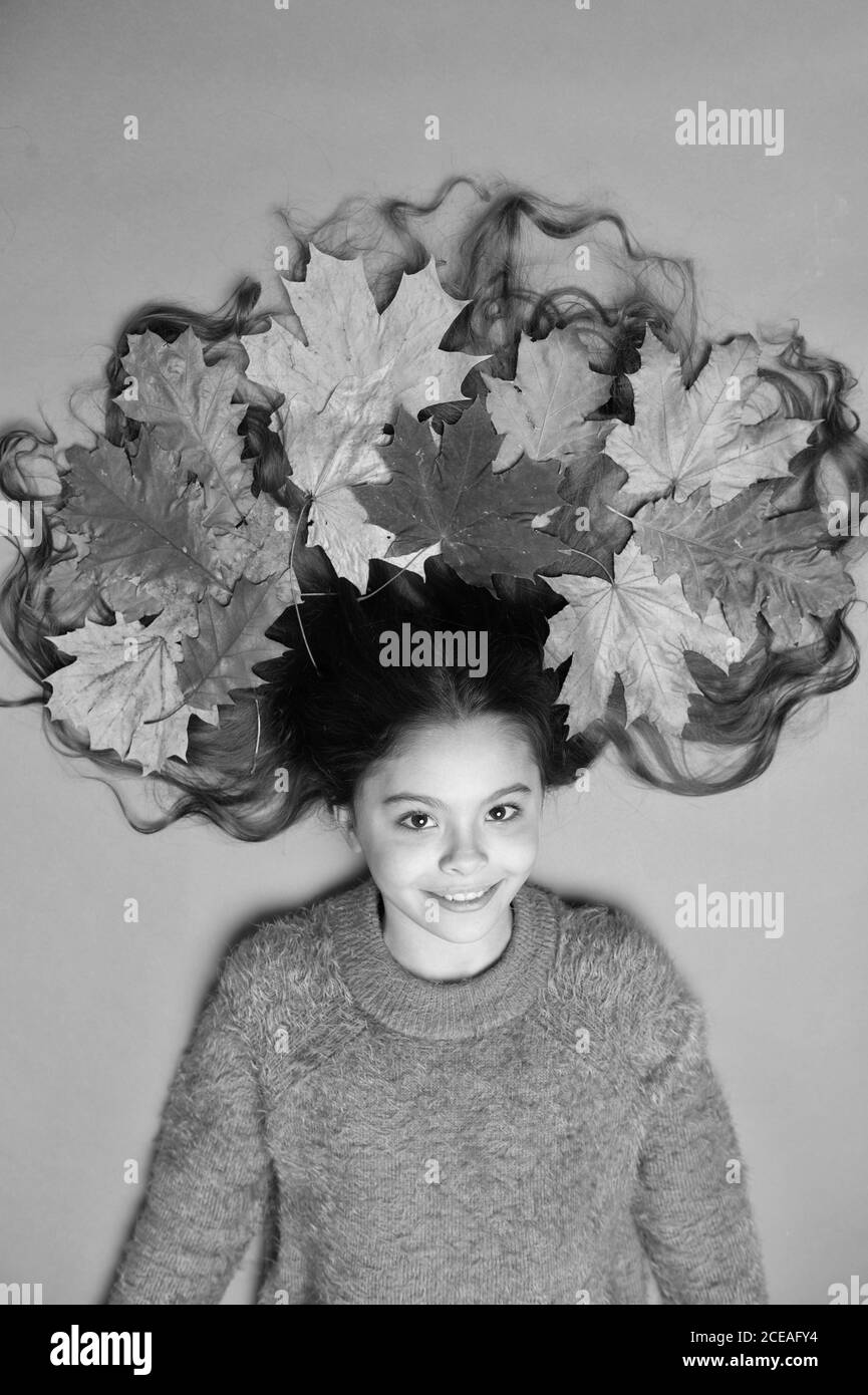 Leafy hairstyle. Small girl wear autumn foliage in curly hairstyle ...
