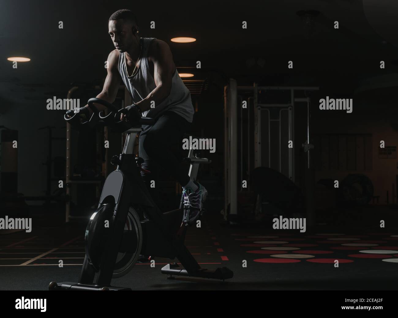 Man on exercise bike in gym hi-res stock photography and images - Alamy