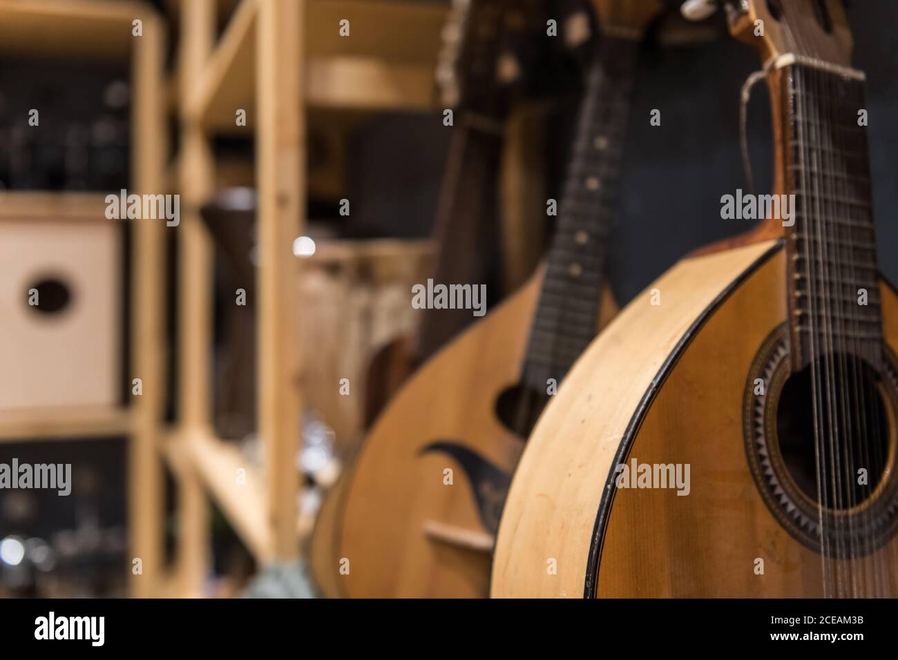 Close-up shot of nice lutes standing on shelf in recording studio Stock ...