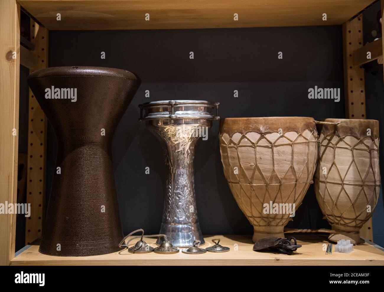 Set of various bongos standing on shelf in rehearse room Stock Photo ...