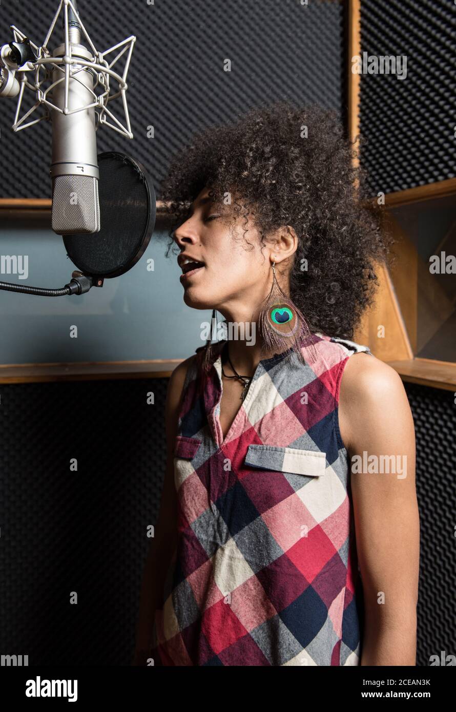 Beautiful woman microphone singing hi-res stock photography and images ...