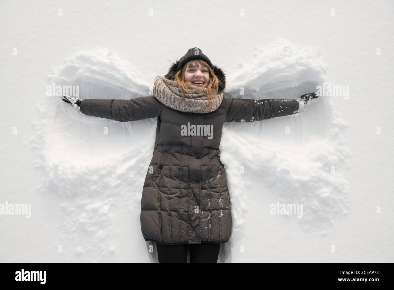 Woman making snow angel hi-res stock photography and images - Alamy