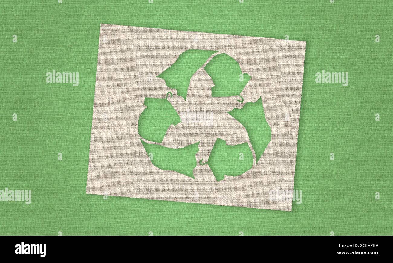 recycle clothes symbol recycle sign cut from reuse fabric on a textile ...