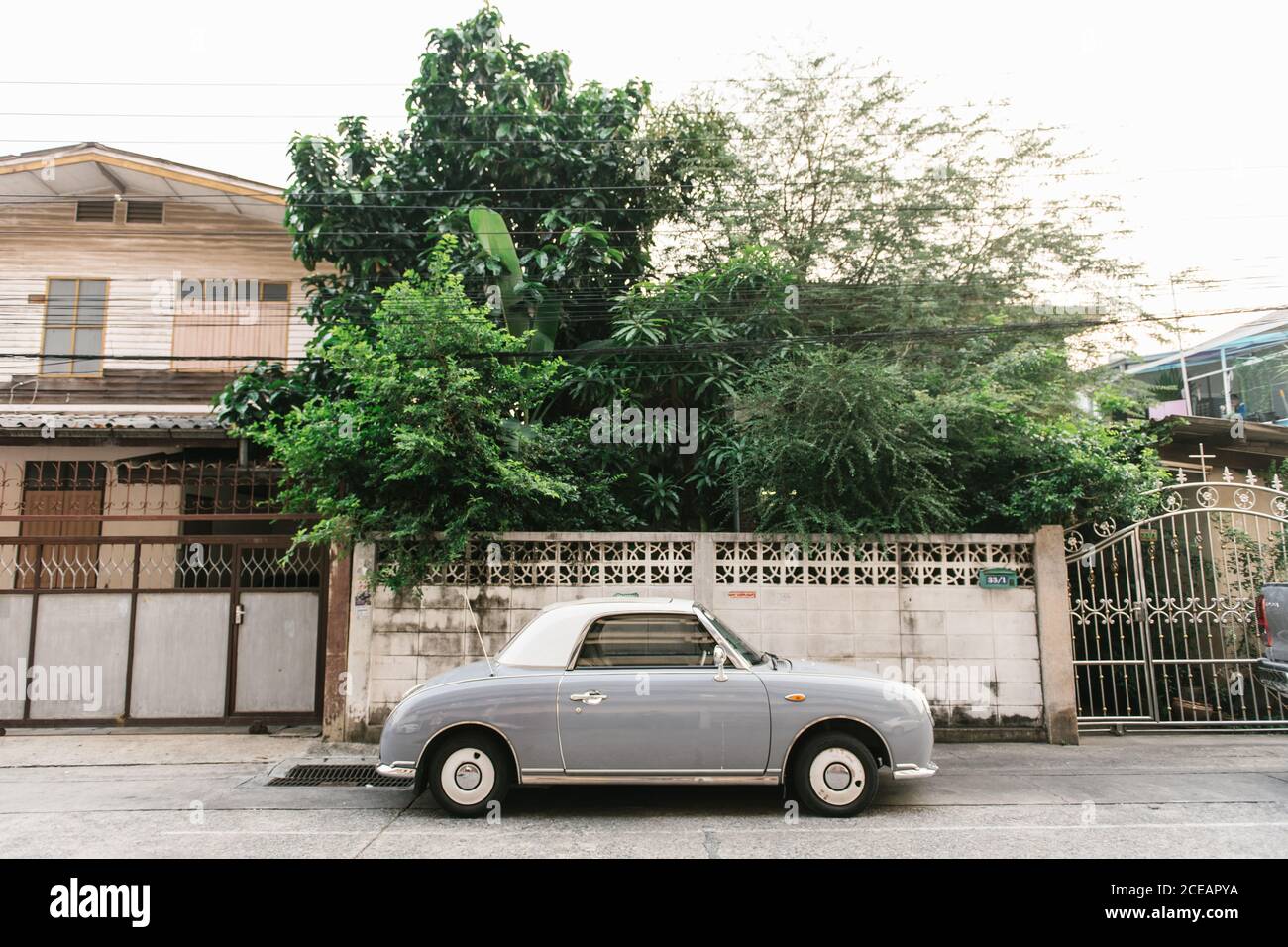 Side view of small gray car parked on Khao San Road Beach, Thailand ...