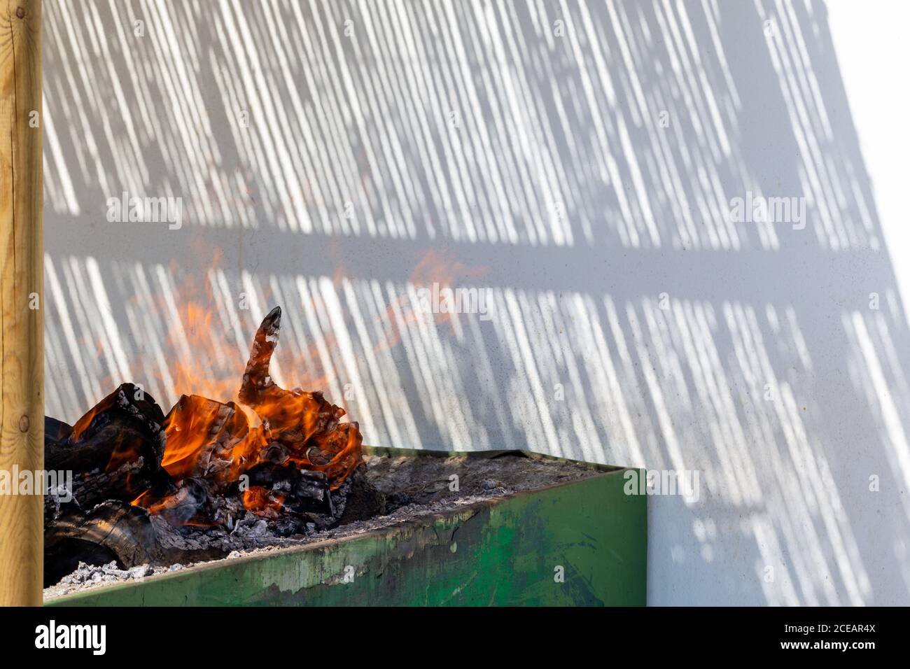 Bonfire under a camp of reeds in a beach bar to grill fish Stock Photo ...