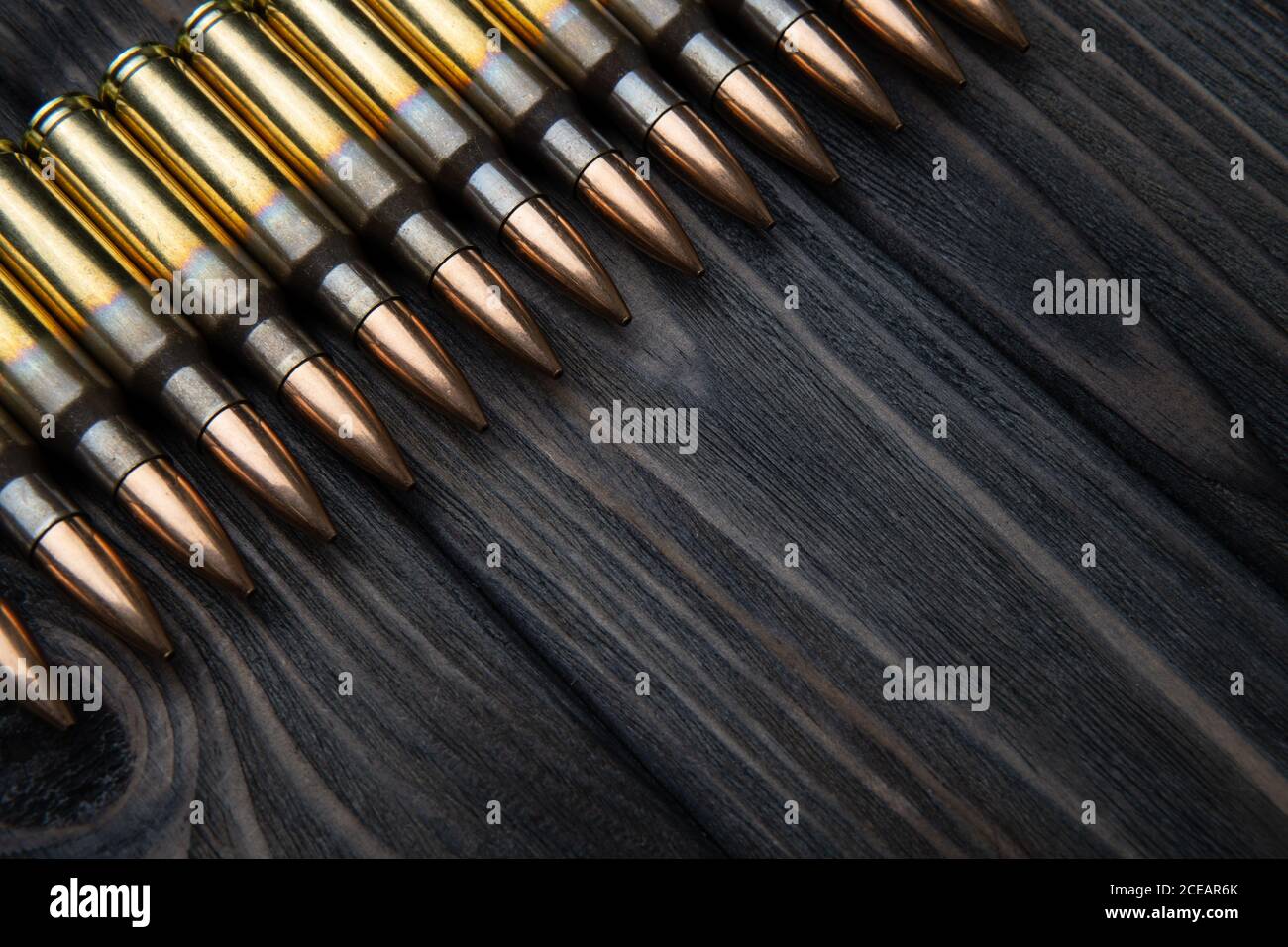 artridges for weapons on a wooden background. Ammunition on a vintage ...