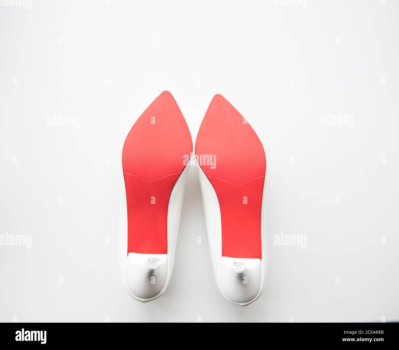 Beautiful classic white bridal shoes with red sole Stock Photo - Alamy