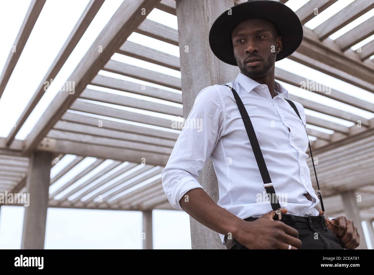 Leaning on white column hi-res stock photography and images - Alamy