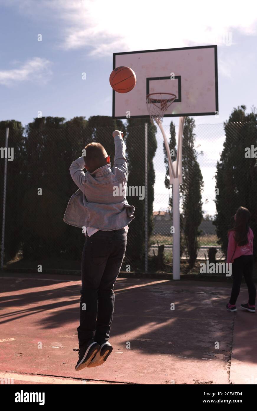 Kid Jumping Back View High Resolution Stock Photography and Images - Alamy