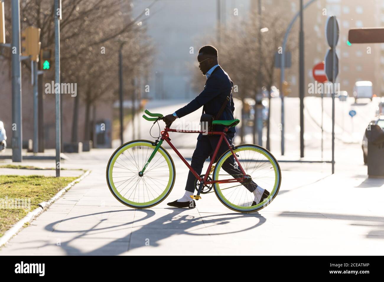 Man walking bicycle hi-res stock photography and images - Alamy