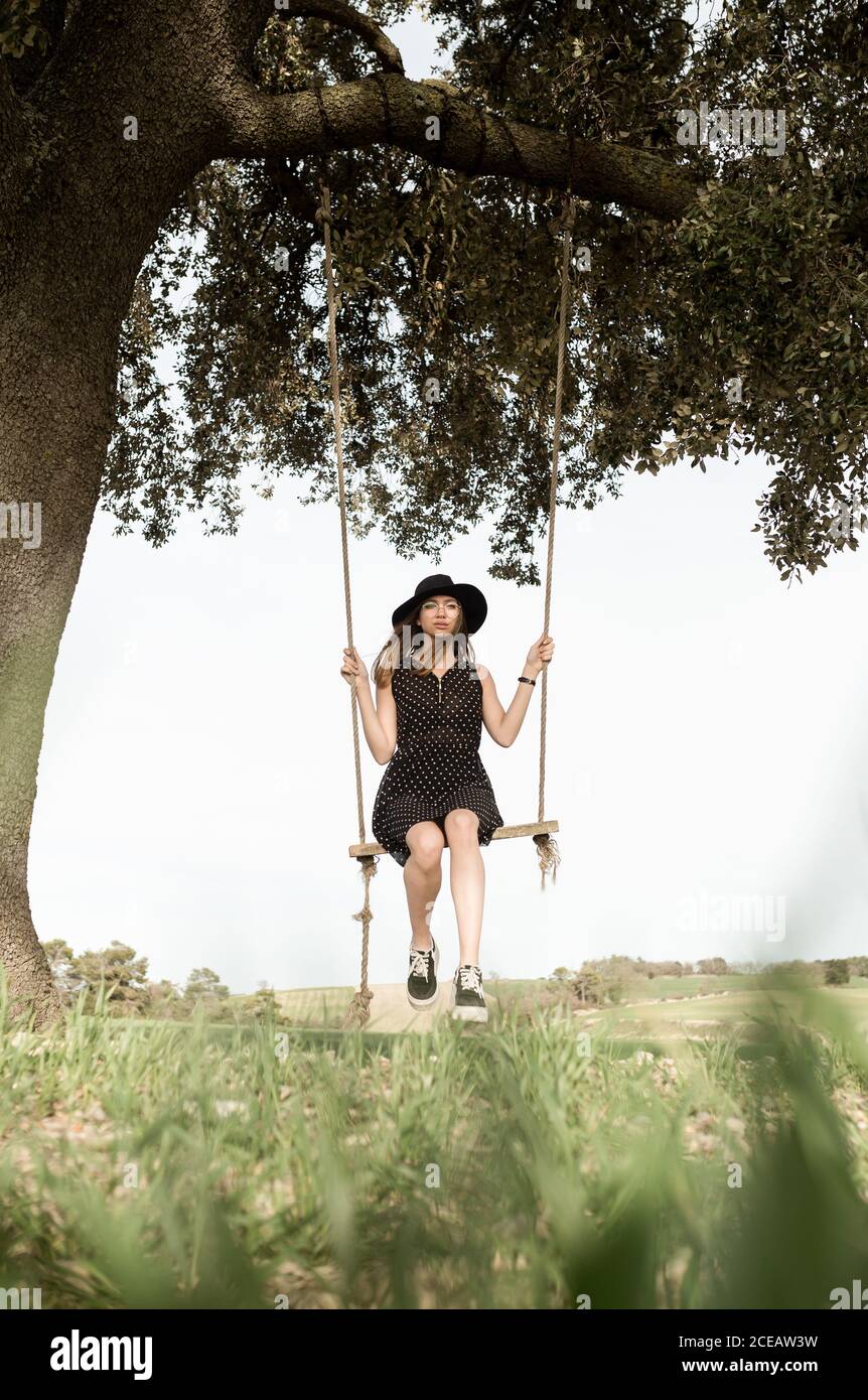 Girl on swings hi-res stock photography and images - Alamy