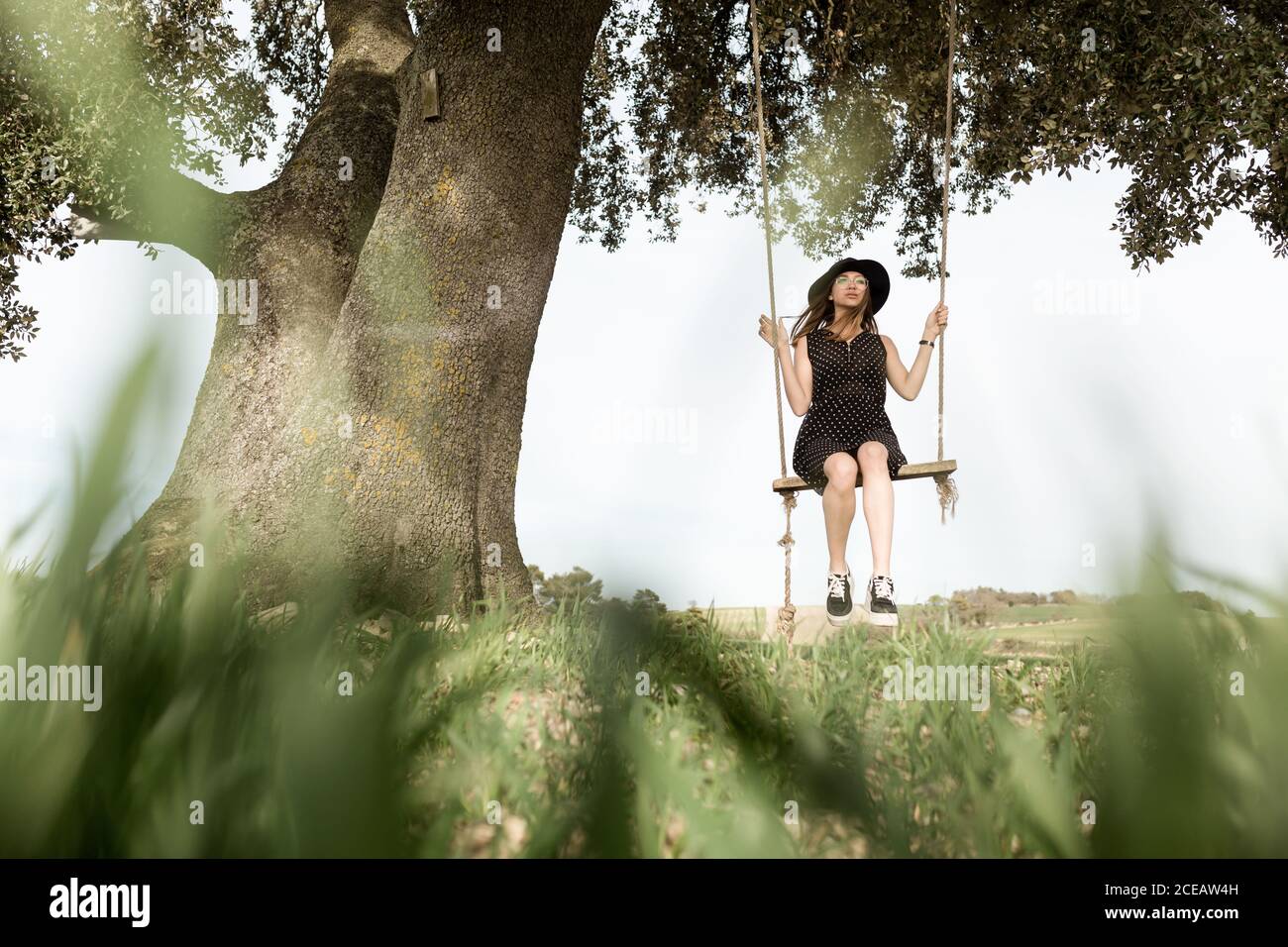 Girl on swings hi-res stock photography and images - Alamy