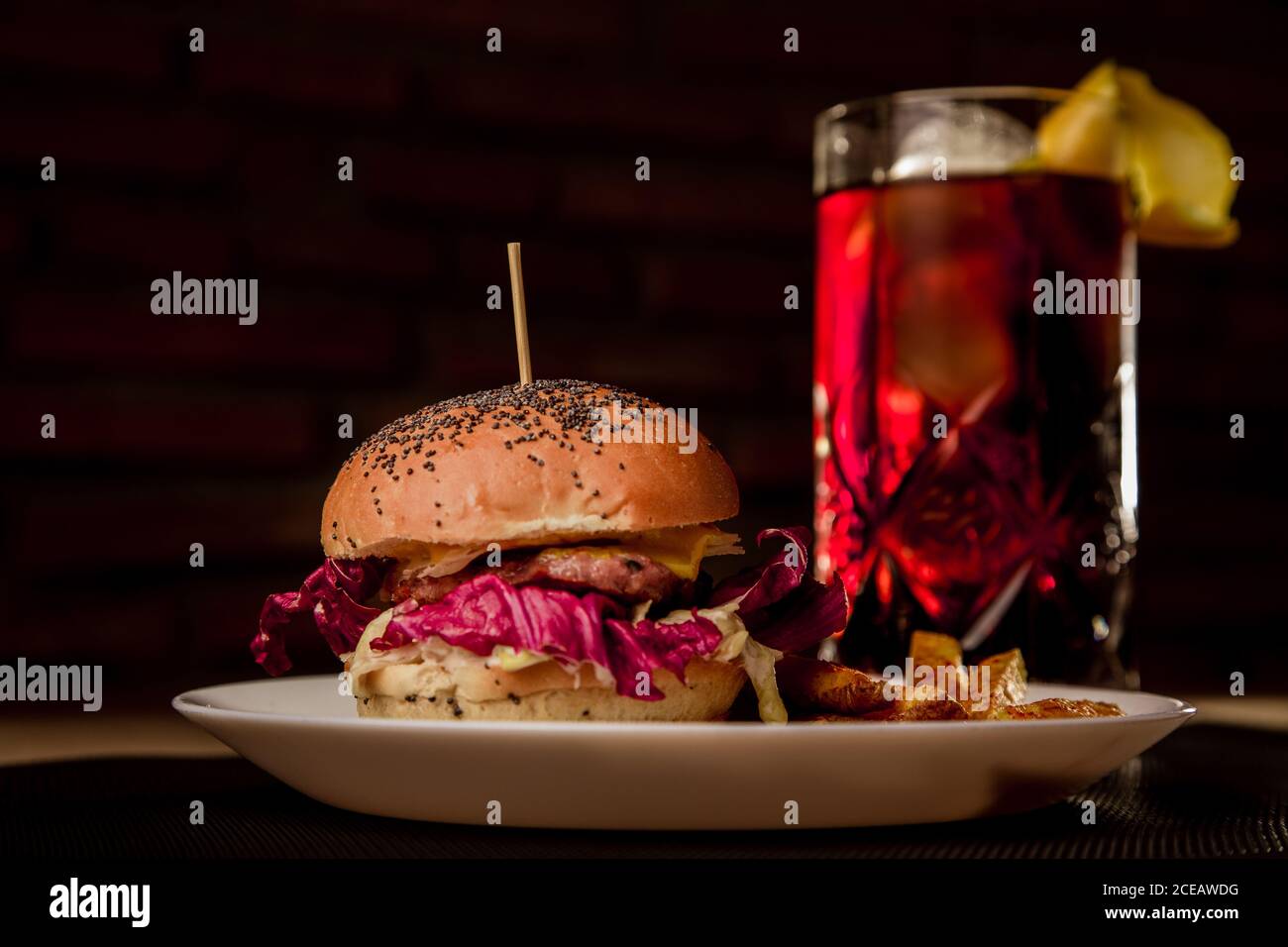 Tasty burger and glass of coke Stock Photo - Alamy