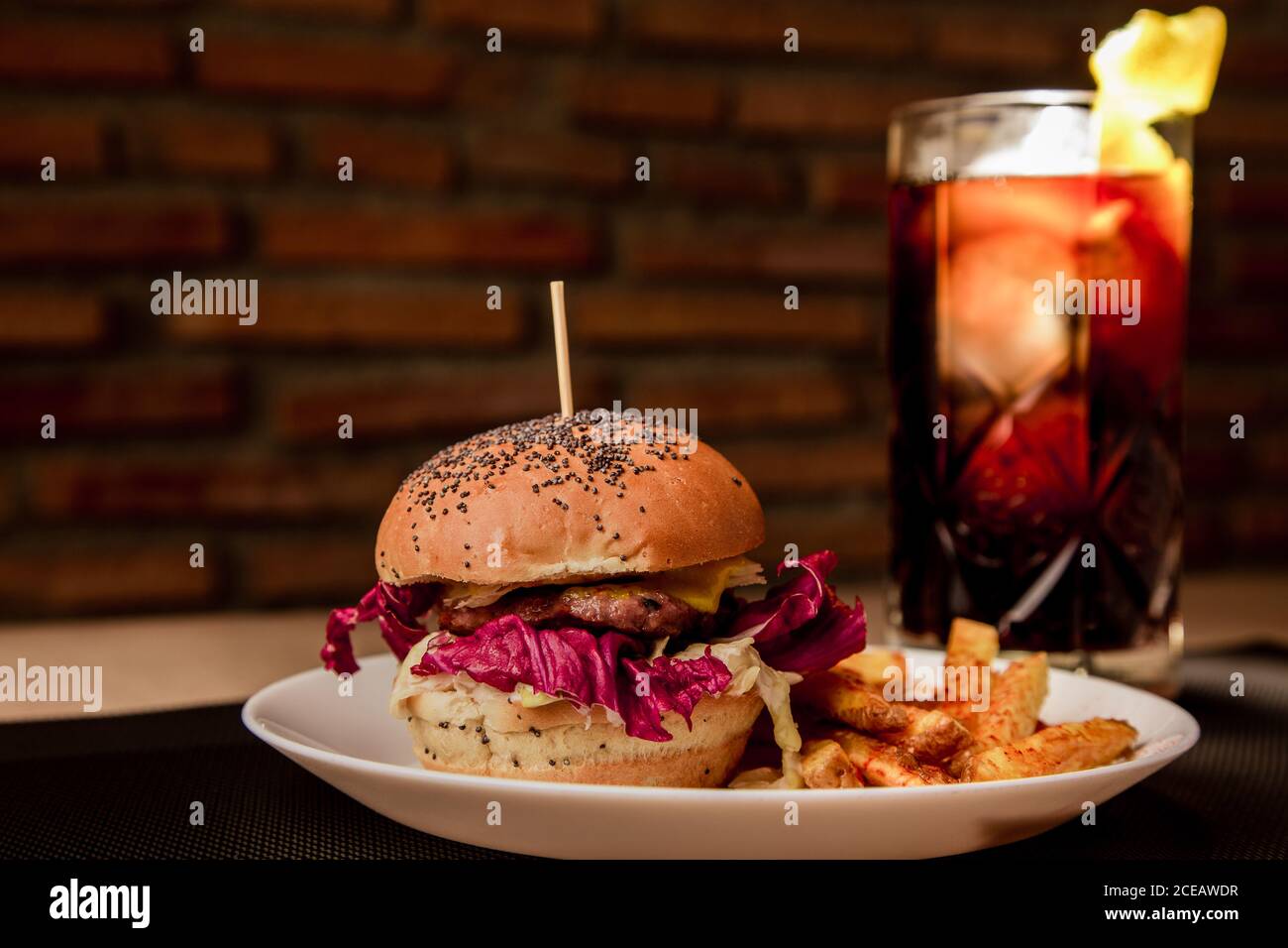 Tasty burger and glass of coke Stock Photo - Alamy