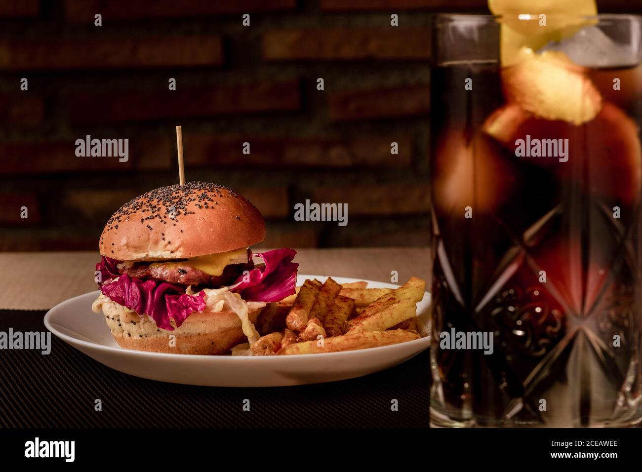 Tasty burger and glass of coke Stock Photo - Alamy
