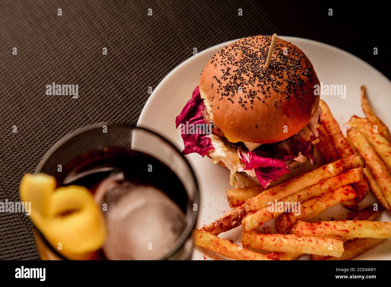 Tasty burger and glass of coke Stock Photo - Alamy