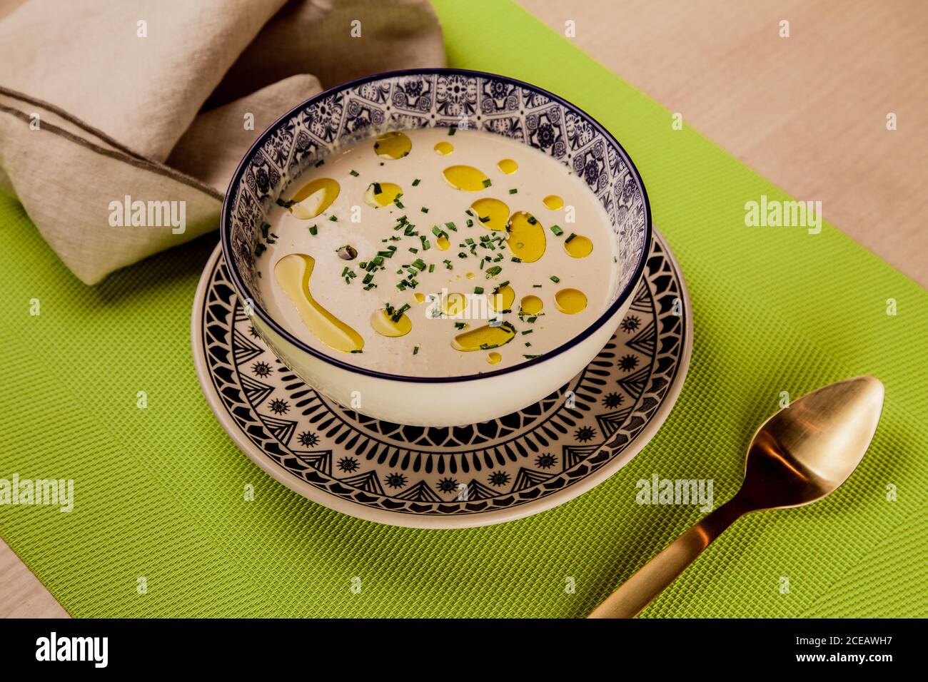 Soup with oil on table Stock Photo - Alamy