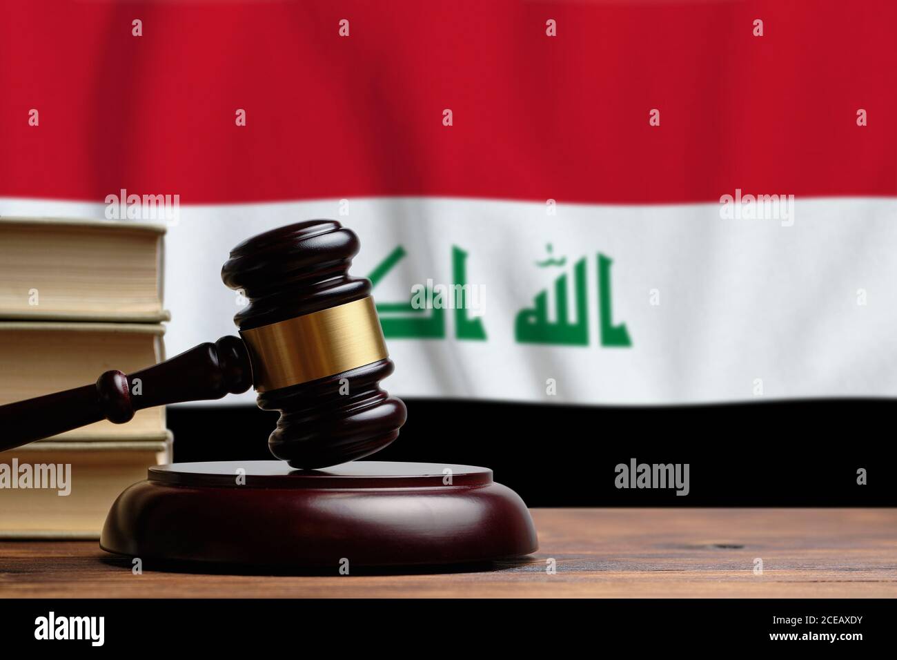 Justice and court concept in Republic of Iraq. Judge hammer on a flag ...