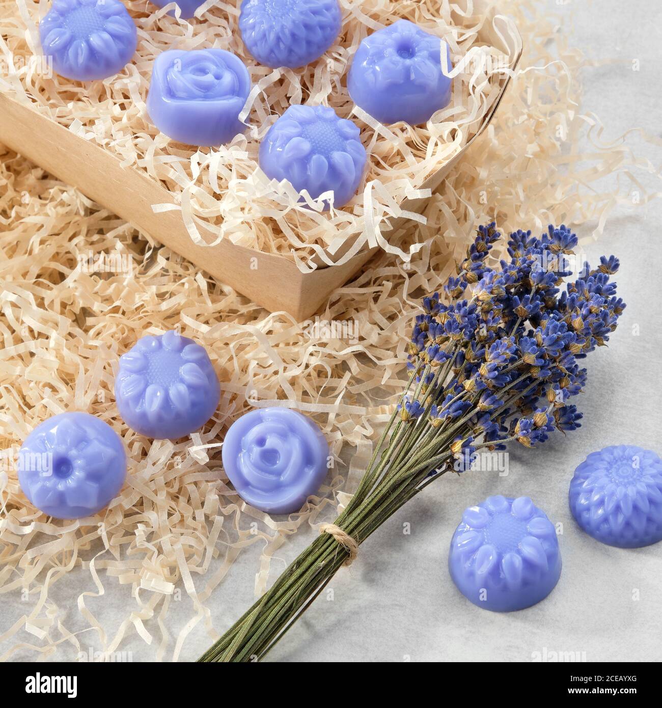 Homemade lavender candy shaped soaps, lavender extract bottle and dry ...