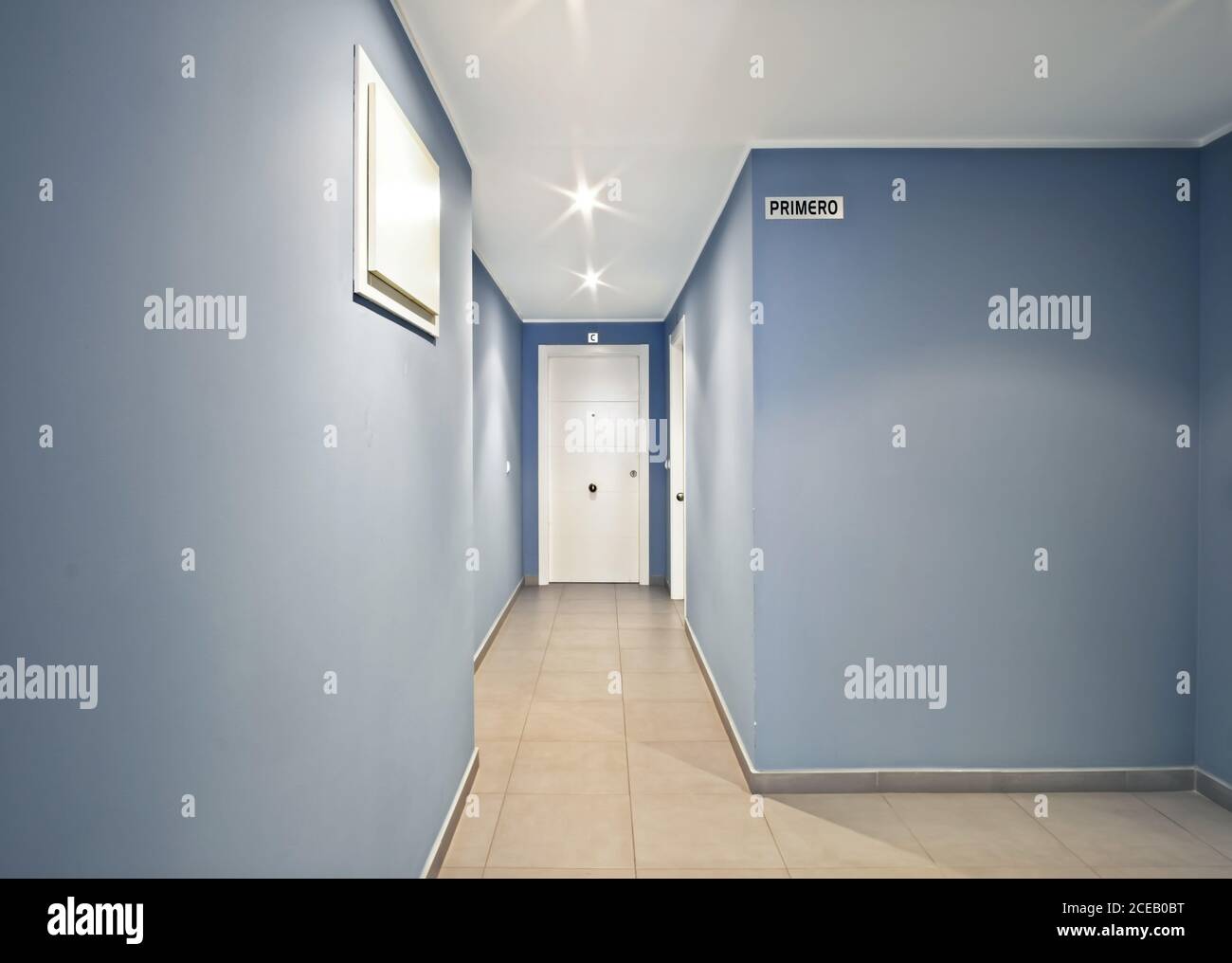 Doors in blue corridor Stock Photo - Alamy
