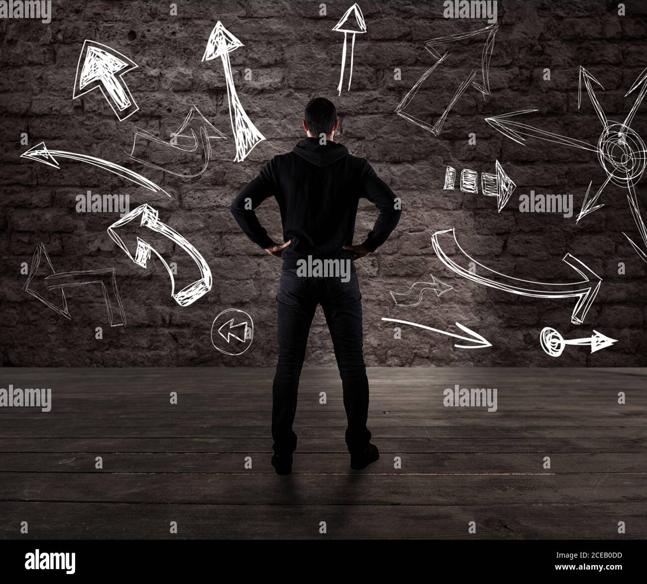 Man is undecided about the right way to follow Stock Photo - Alamy
