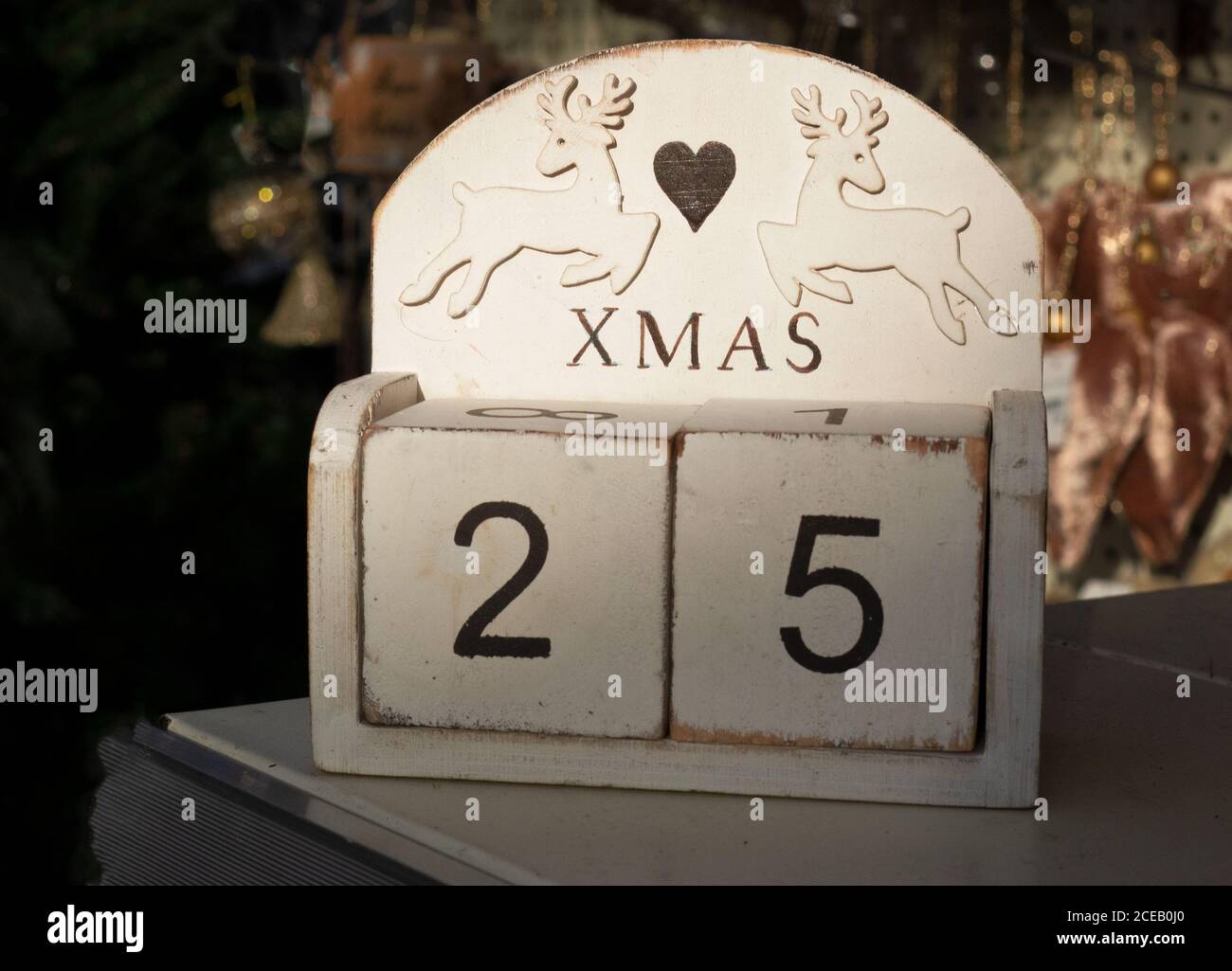 vintage light wood advent calendar with numbers painted on two cubes ...
