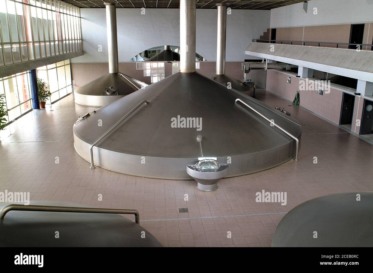 High beer tanks placed outside Stock Photo - Alamy