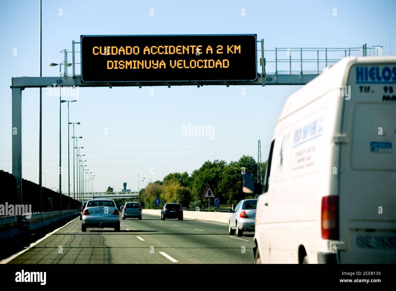 View of hanging electric traffic sign on highway warning about accident ...