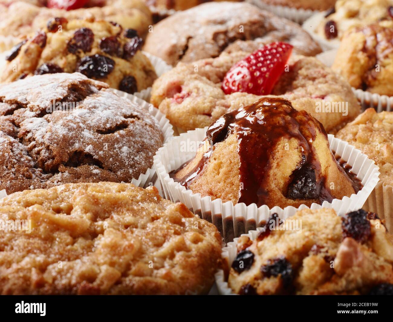 From above view of tasty cakes with raisins and strawberry with ...