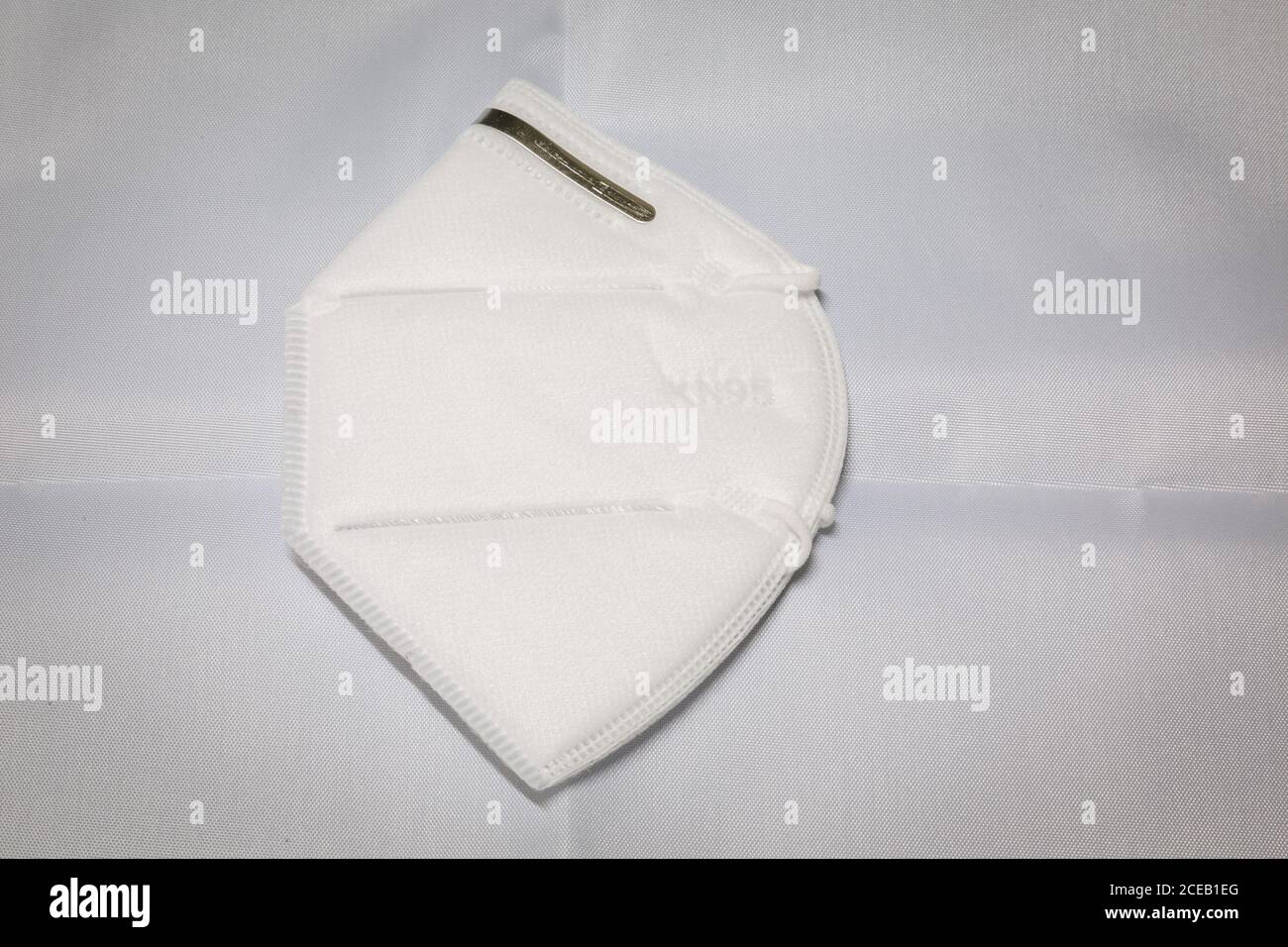 Information on the product label at the local pharmacy: KN95 (Mask for ...