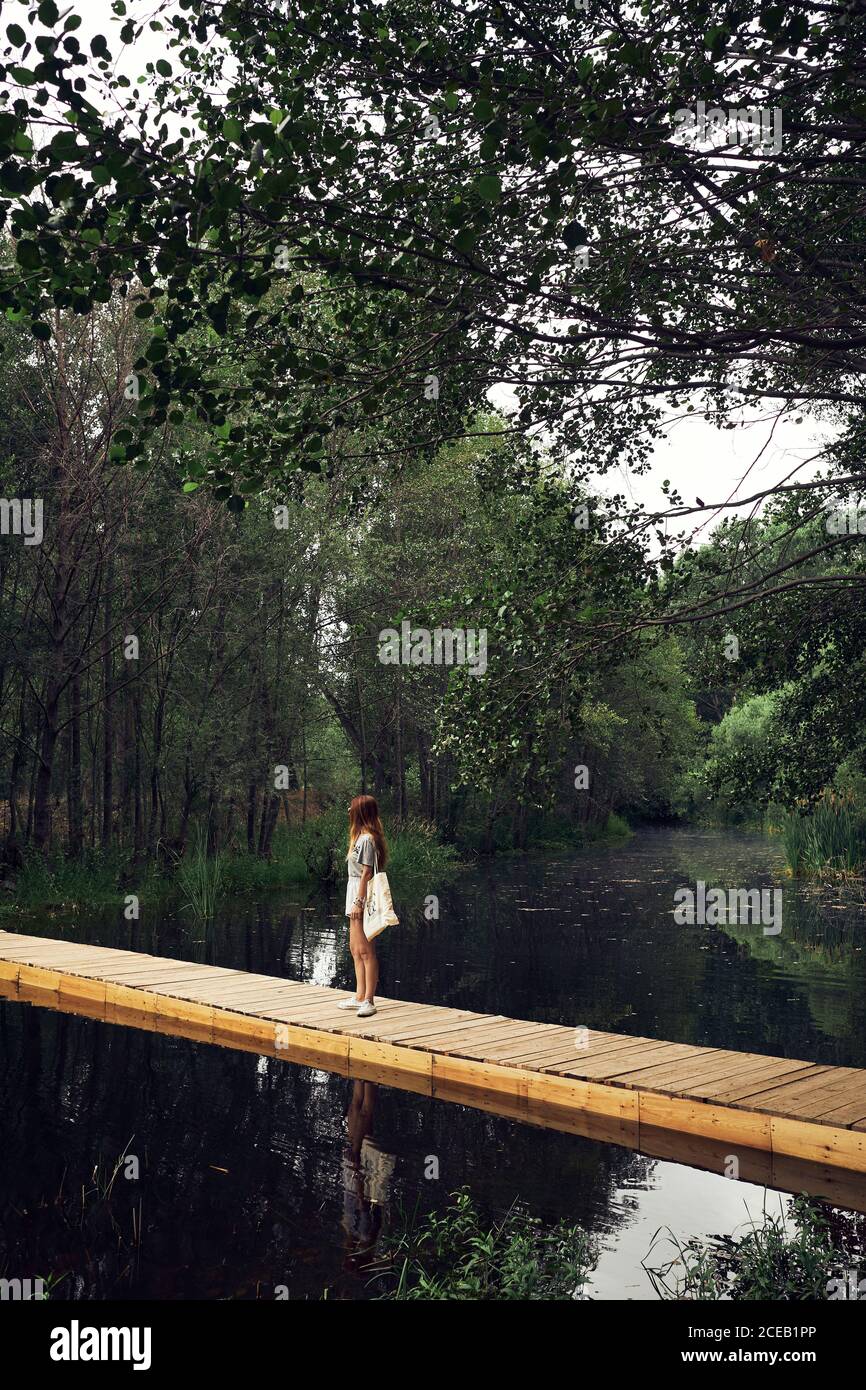 Female tourist walking over bridge hi-res stock photography and images ...