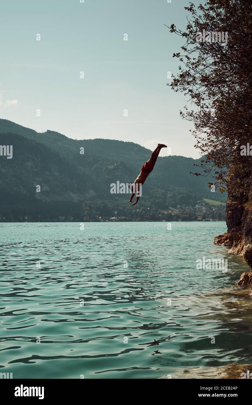 man jumping in water Stock Photo - Alamy