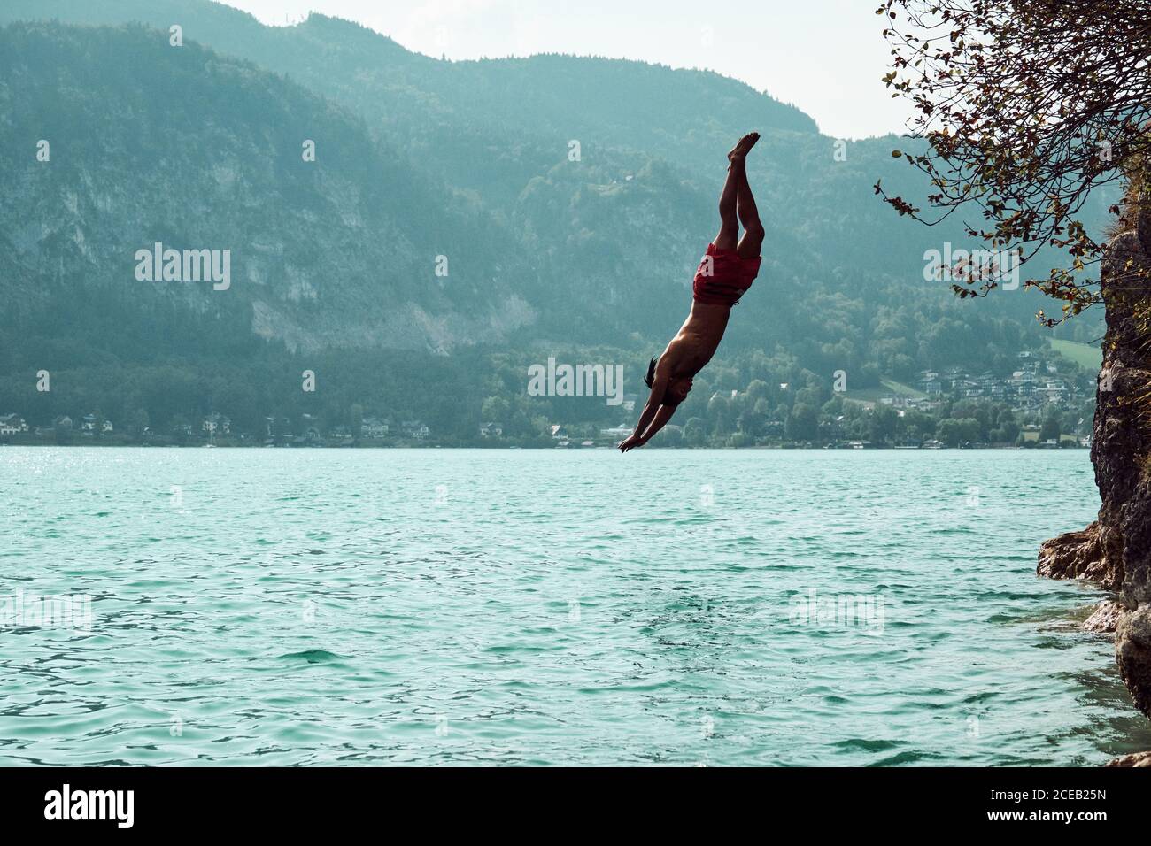 man jumping in water Stock Photo - Alamy