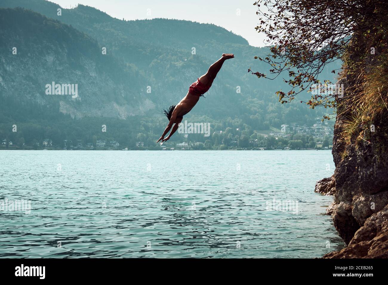 Man jumping into water hi-res stock photography and images - Alamy