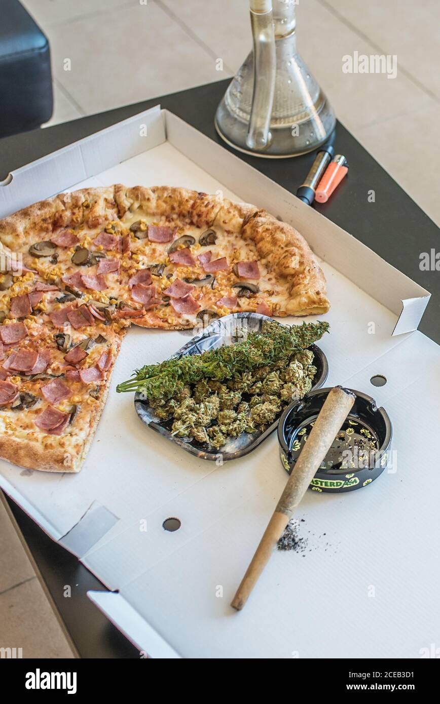 Marijuana or cannabis plant and a pizza Stock Photo - Alamy