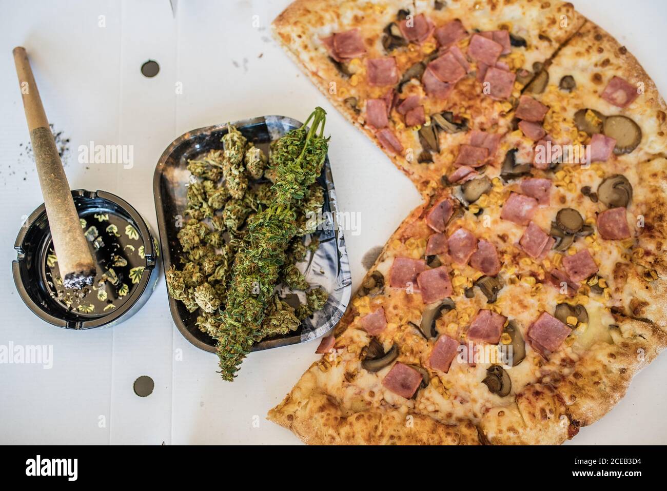Marijuana or cannabis plant and a pizza Stock Photo - Alamy