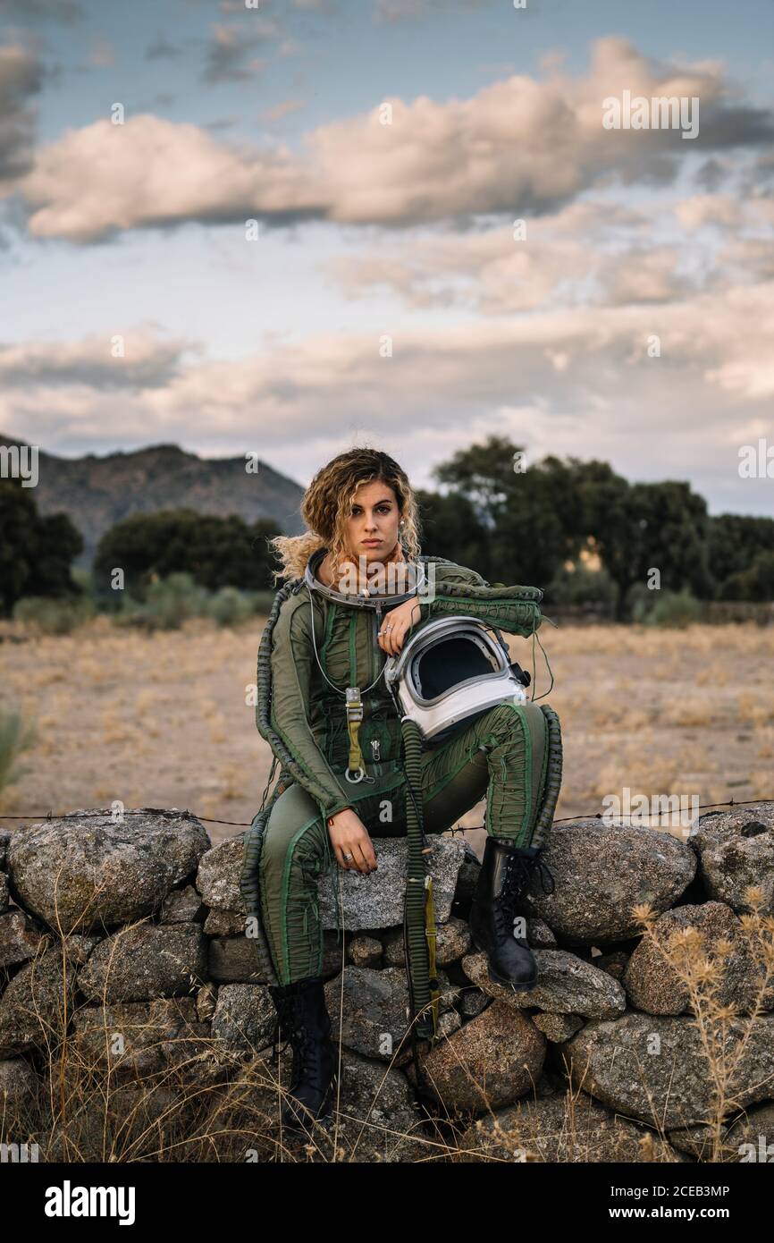 Beautiful Woman posing dressed as an astronaut Stock Photo - Alamy